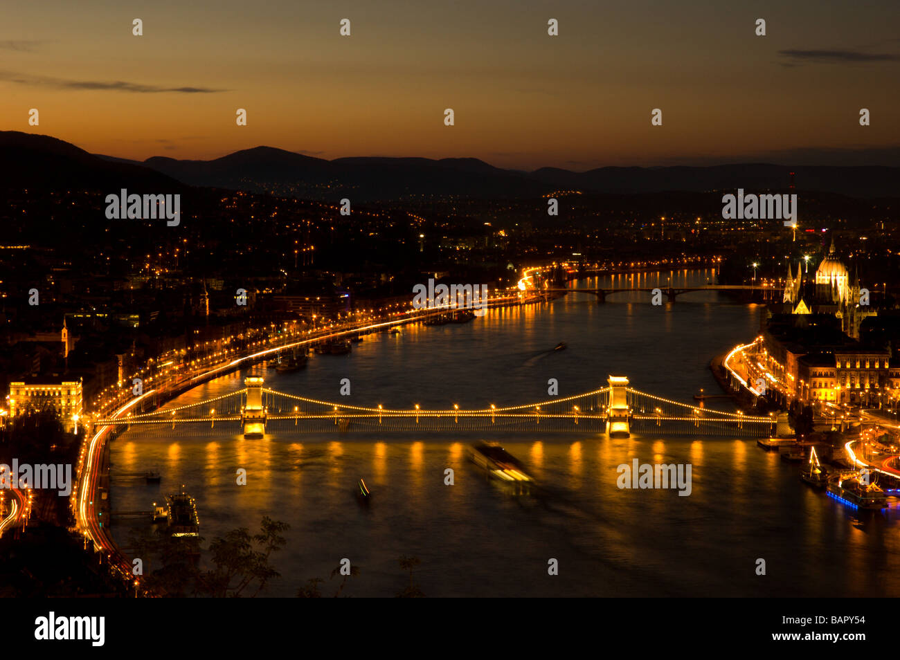 The famous Chain Bridge in Budapest illuminated at night Stock Photo ...