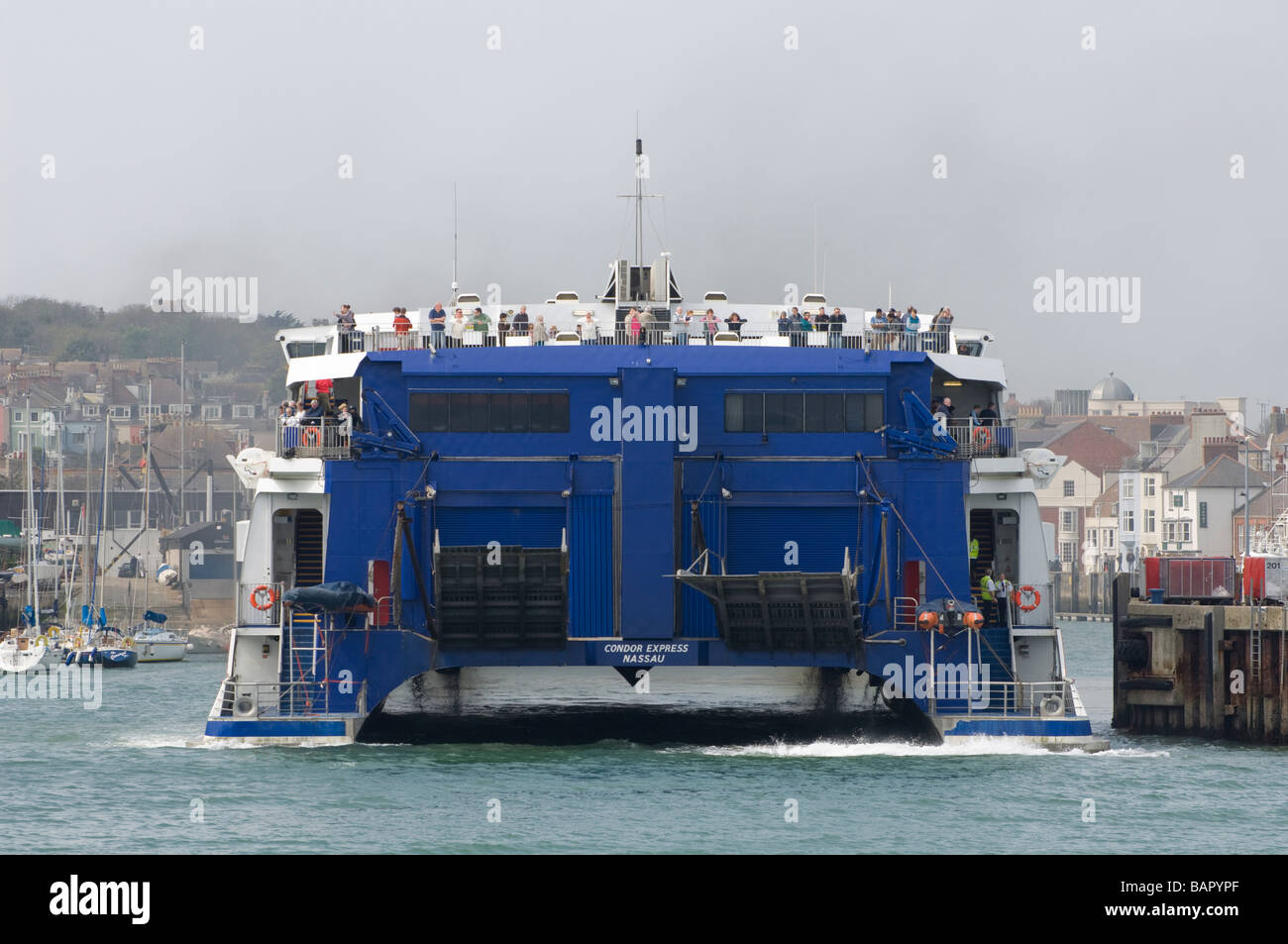 Fumes rising into the air from the engines of the Condor Express seacat ...