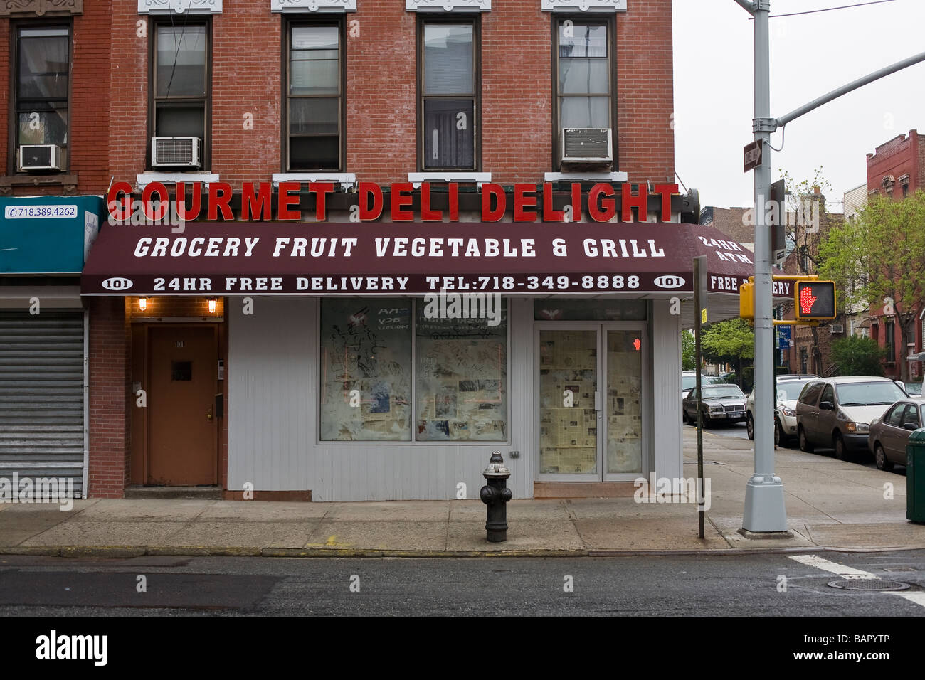 A neighborhood deli has closed and papered over its windows Stock Photo ...