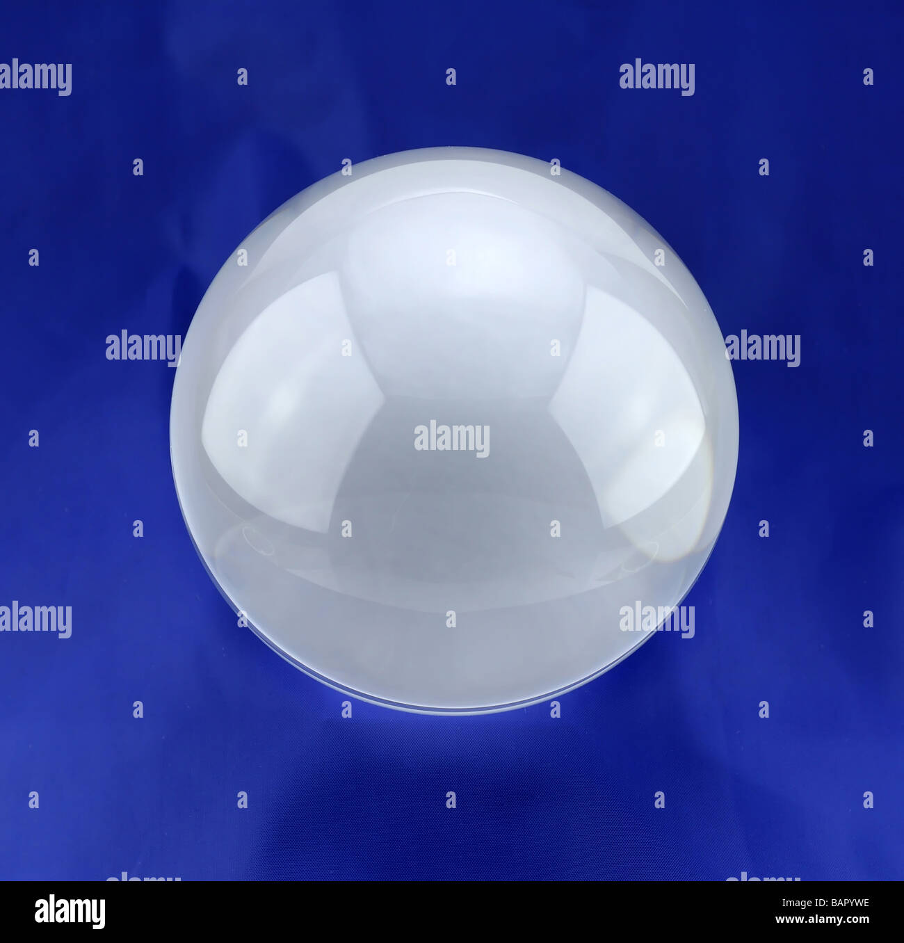 Crystal ball on plain background Stock Photo - Alamy