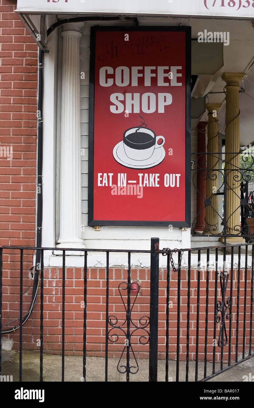 A tired coffee shop sign in a run down nieghborhood Stock Photo - Alamy