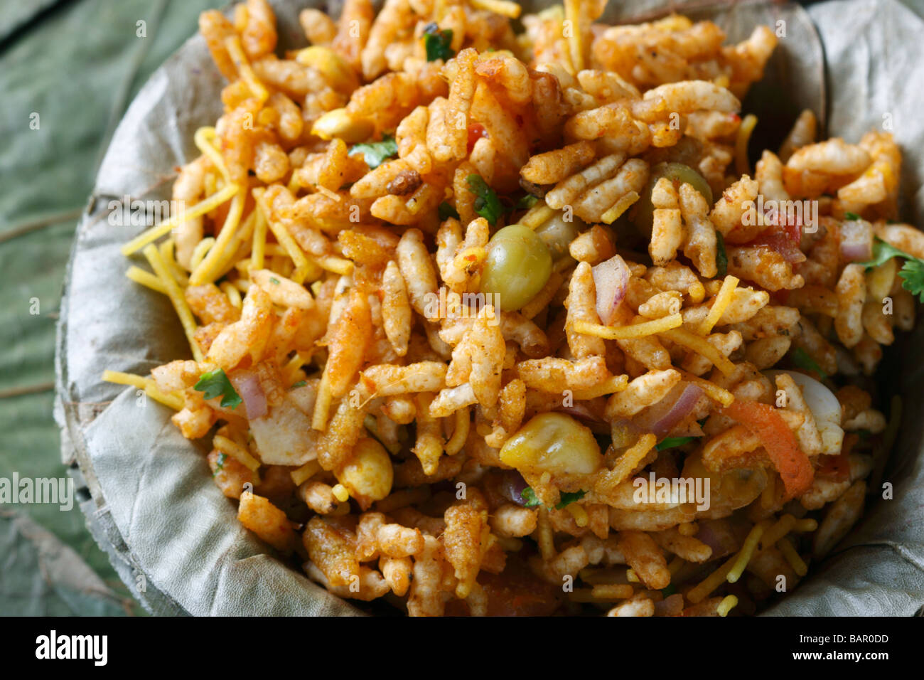 Bhel puri is a sweet and spicy combination of puffed rice, onions ...