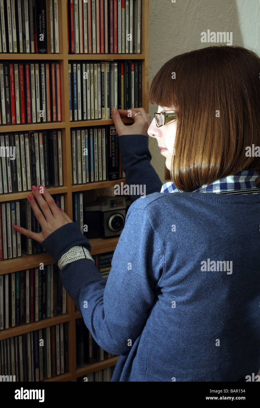 teenage girl selecting cd Stock Photo - Alamy