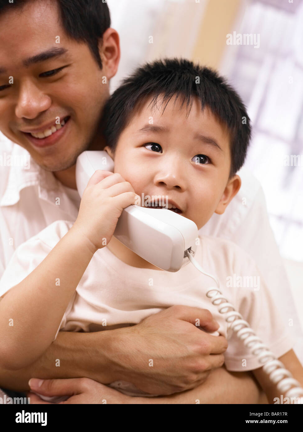 father and son making phone call together Stock Photo - Alamy