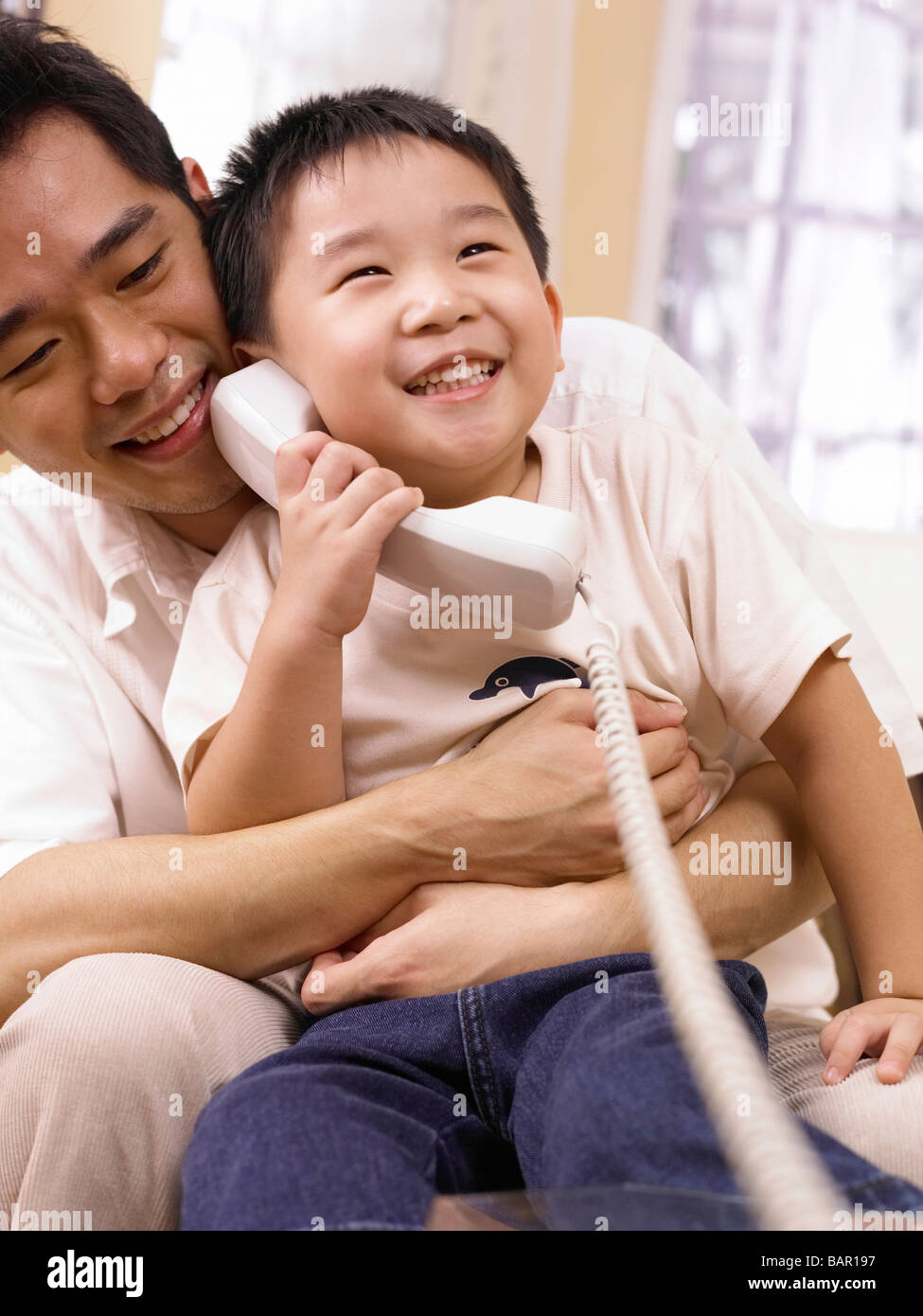 father and son making phone call Stock Photo - Alamy