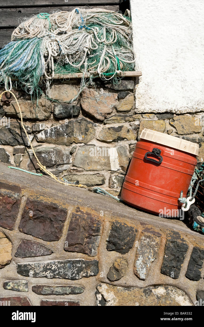 Fishing nets and equipment on the harbourside Stock Photo - Alamy