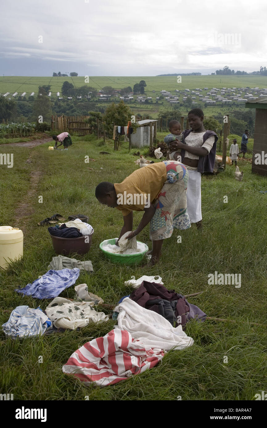 Lady washing clothes hi-res stock photography and images - Alamy