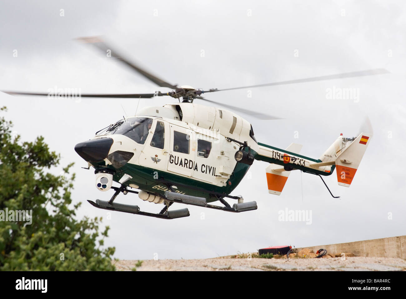 Spanish Guardia Civil helicopter coming in to land Stock Photo - Alamy