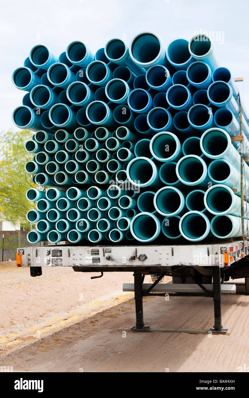 pvc water and sewer pipe being transported to a construction site Stock ...