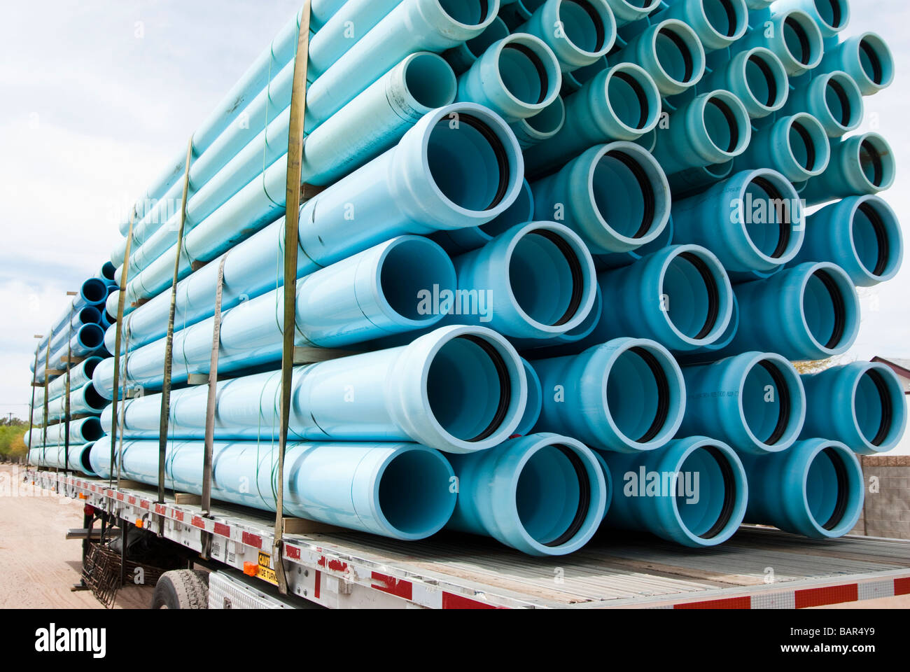 pvc water and sewer pipe being transported to a construction site Stock ...