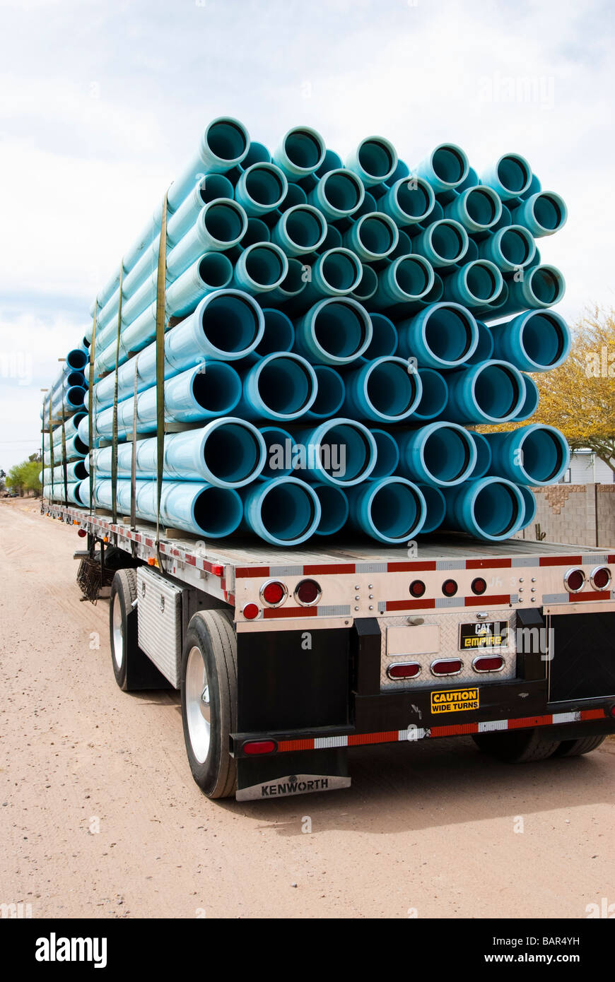 pvc water and sewer pipe being transported to a construction site Stock ...