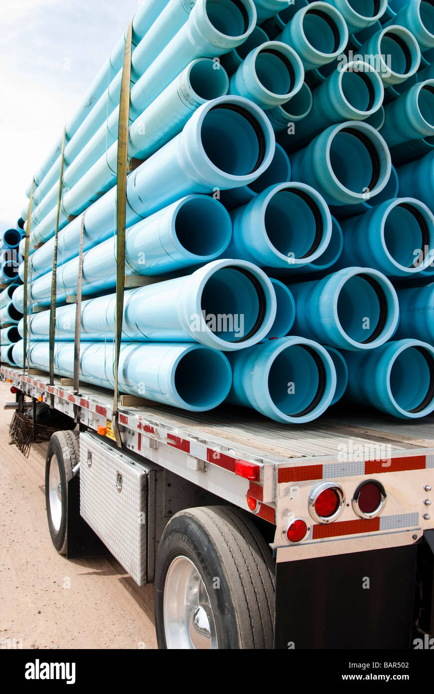 pvc water and sewer pipe being transported to a construction site Stock ...