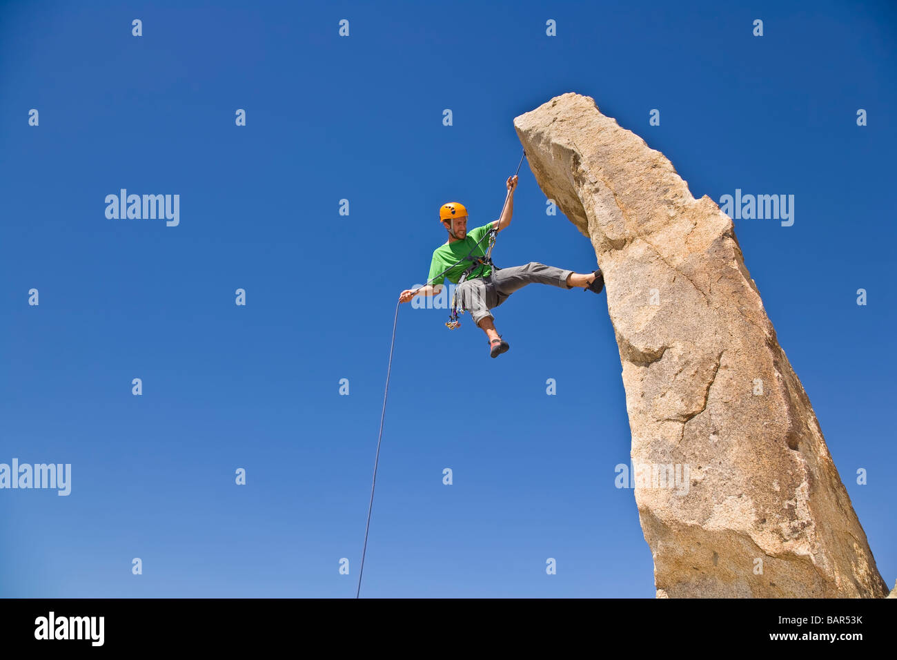 Silhouette rappelling from cliff hi-res stock photography and images ...