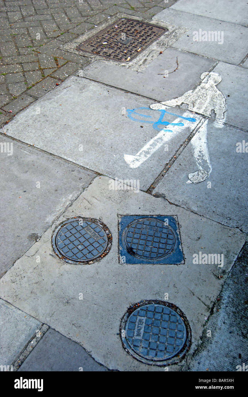 image of walking man on british pavement to indicate a pedestrian route ...