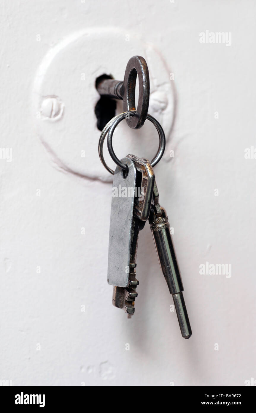 Key in keyhole, close-up Stock Photo - Alamy
