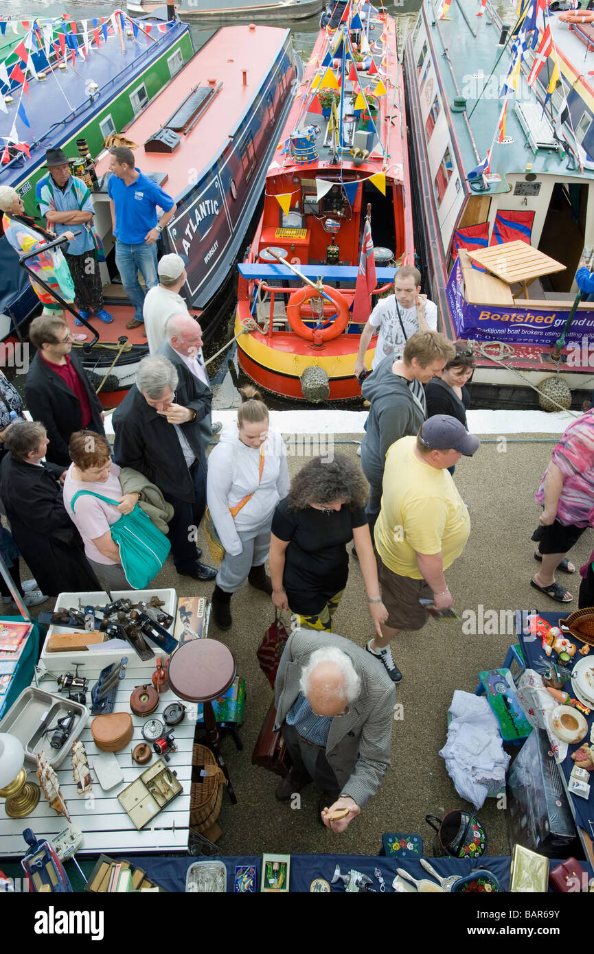 Sidewalk market stall by canal selling souvenirs and antiques during ...