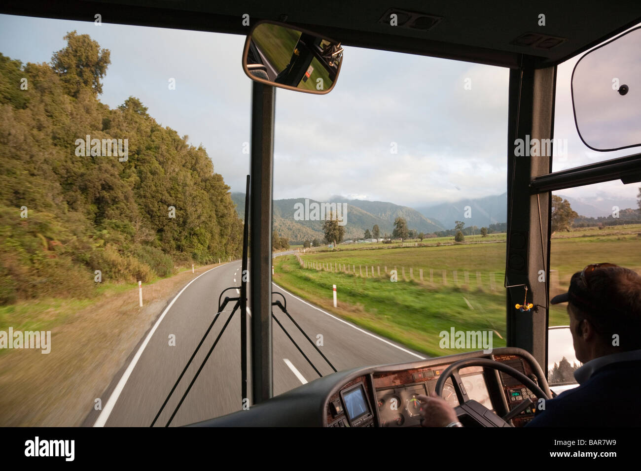 New Zealand View through coach front windscreen with driver driving ...