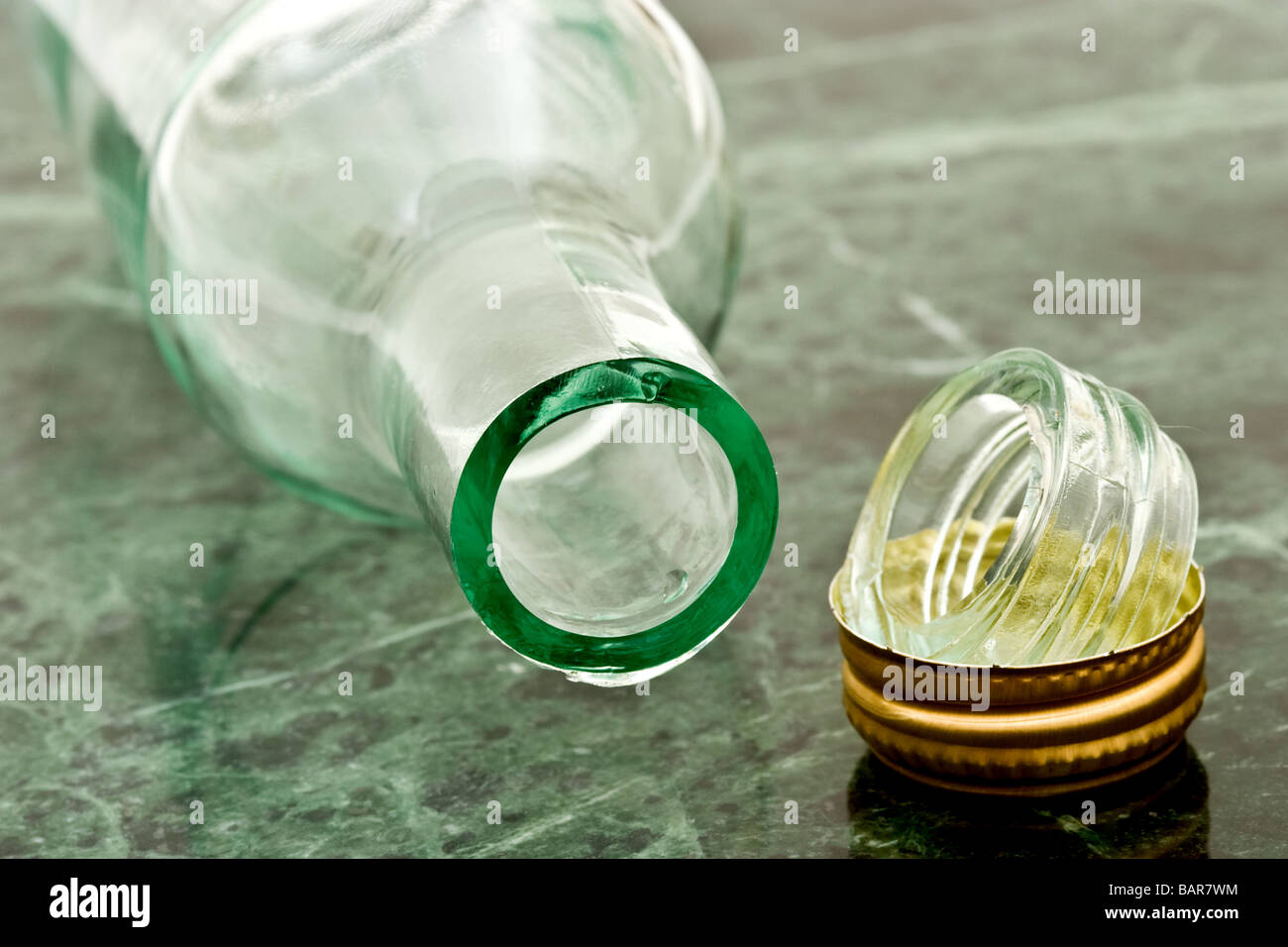 Glass bottle cut off at the neck with a golden bottle cap Stock Photo ...