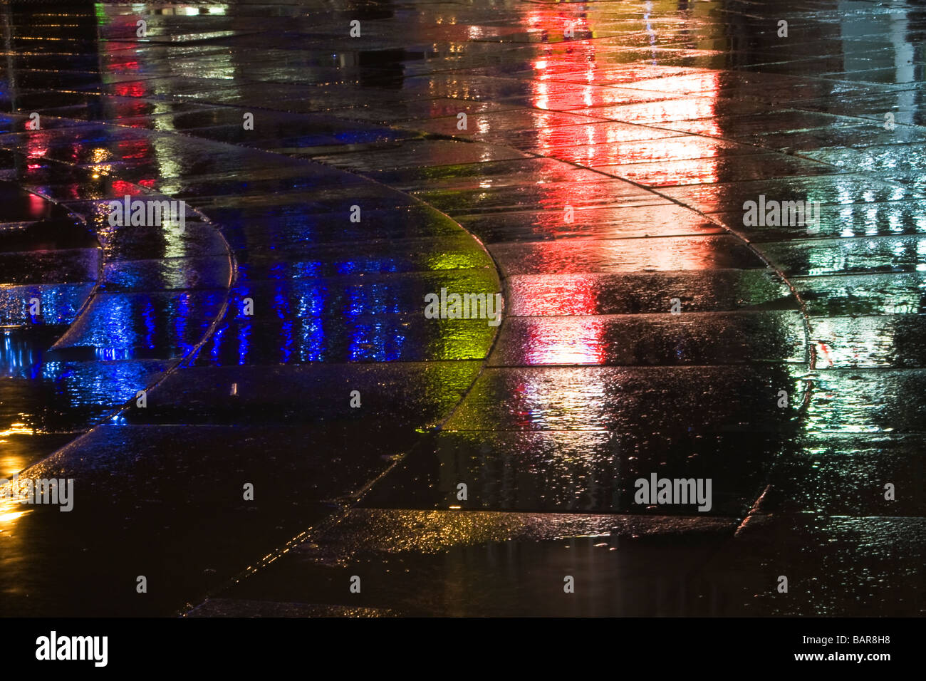 Neon lights reflected on wet Newcastle pavement Stock Photo - Alamy
