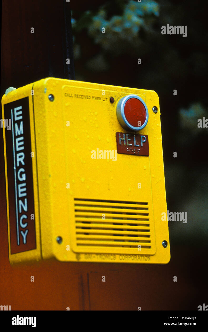 Bright yellow emergency call box Stock Photo - Alamy