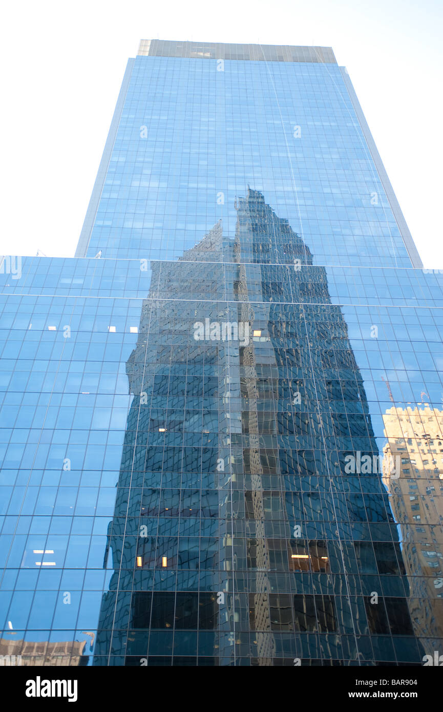 Urban buildings reflected in the glass windows of skyscrapers Stock ...