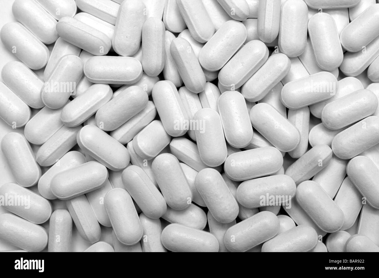 background with lot of gray pills Stock Photo - Alamy