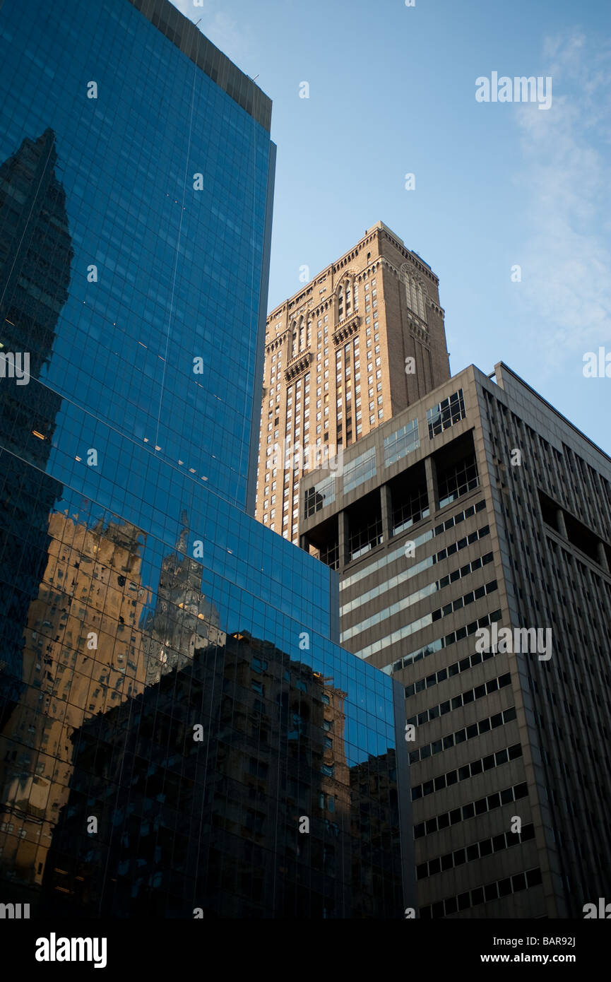 Urban buildings reflected in the glass windows of skyscrapers Stock ...