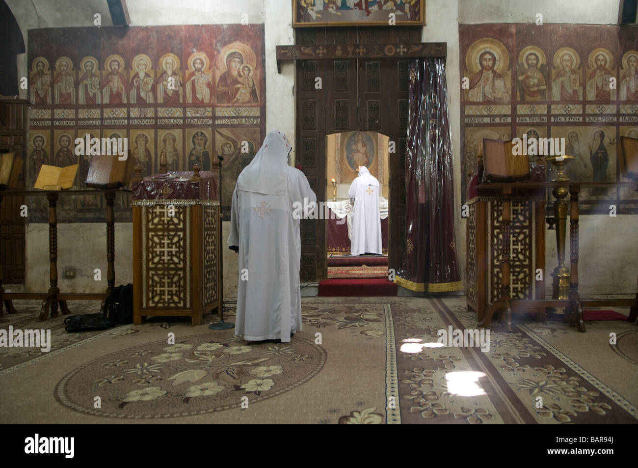 Coptic priests ritual process inside the Red Monastery Deir al Anba Bishoy or Bishai, Pshoi ...