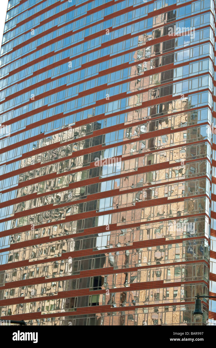 Urban buildings reflected in the glass windows of skyscrapers Stock ...