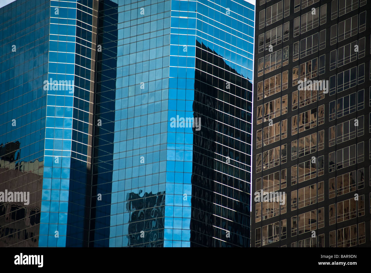 Glass skyscrapers reflect city scenery hi-res stock photography and ...