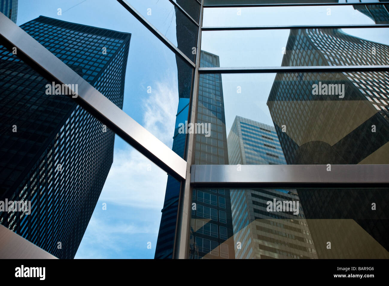 Urban buildings reflected in the glass windows of skyscrapers Stock ...