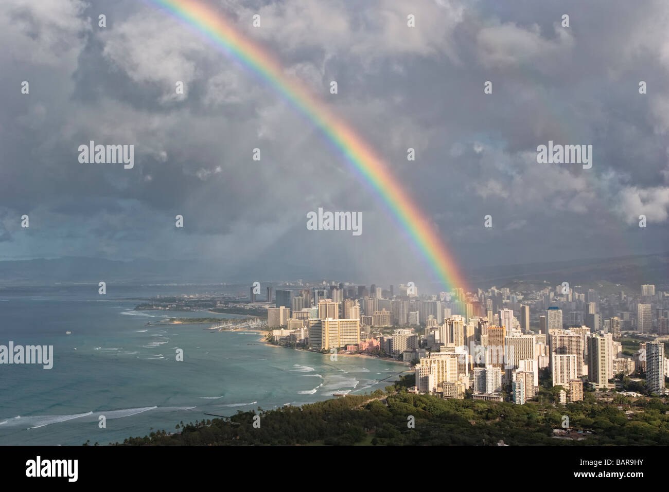 A rainbow over Honolulu and Waikiki Beach, seen from Diamond Head Stock ...