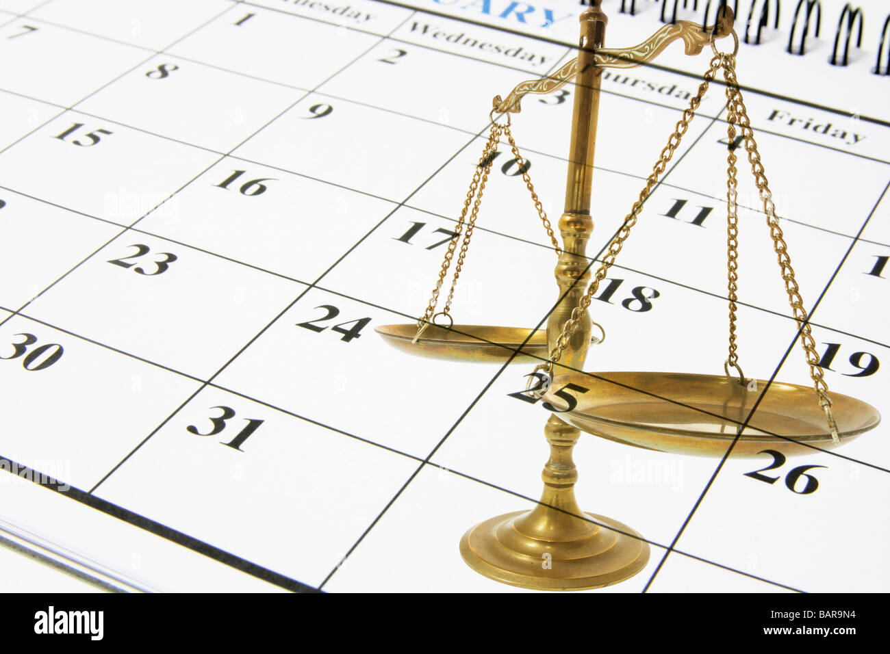 Calendar Page and Brass Scale Stock Photo - Alamy