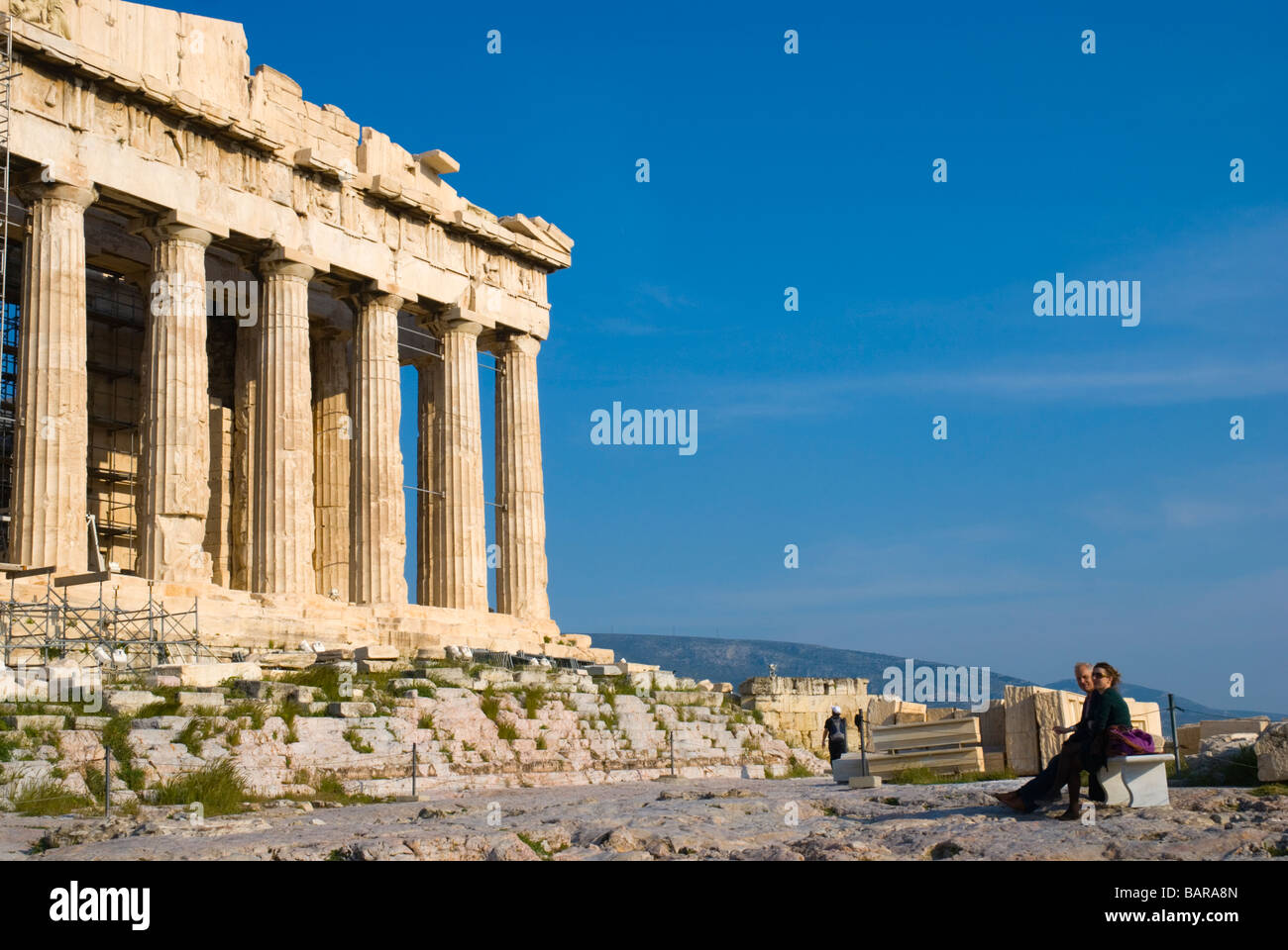 Two People In Front Of The Parthenon