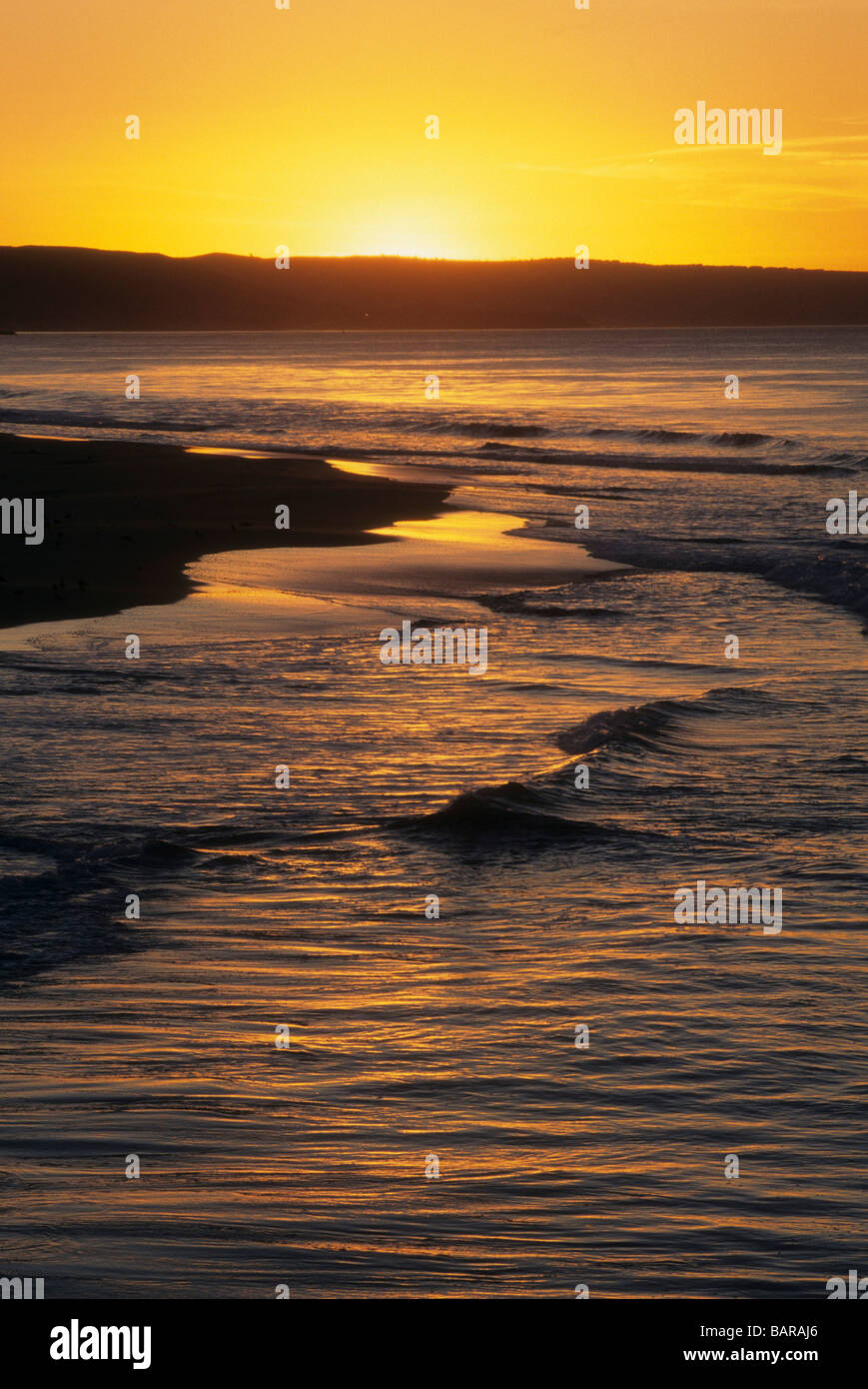 Sun sunset ocean sea wave surf beach glow shine shimmer gold end day ...