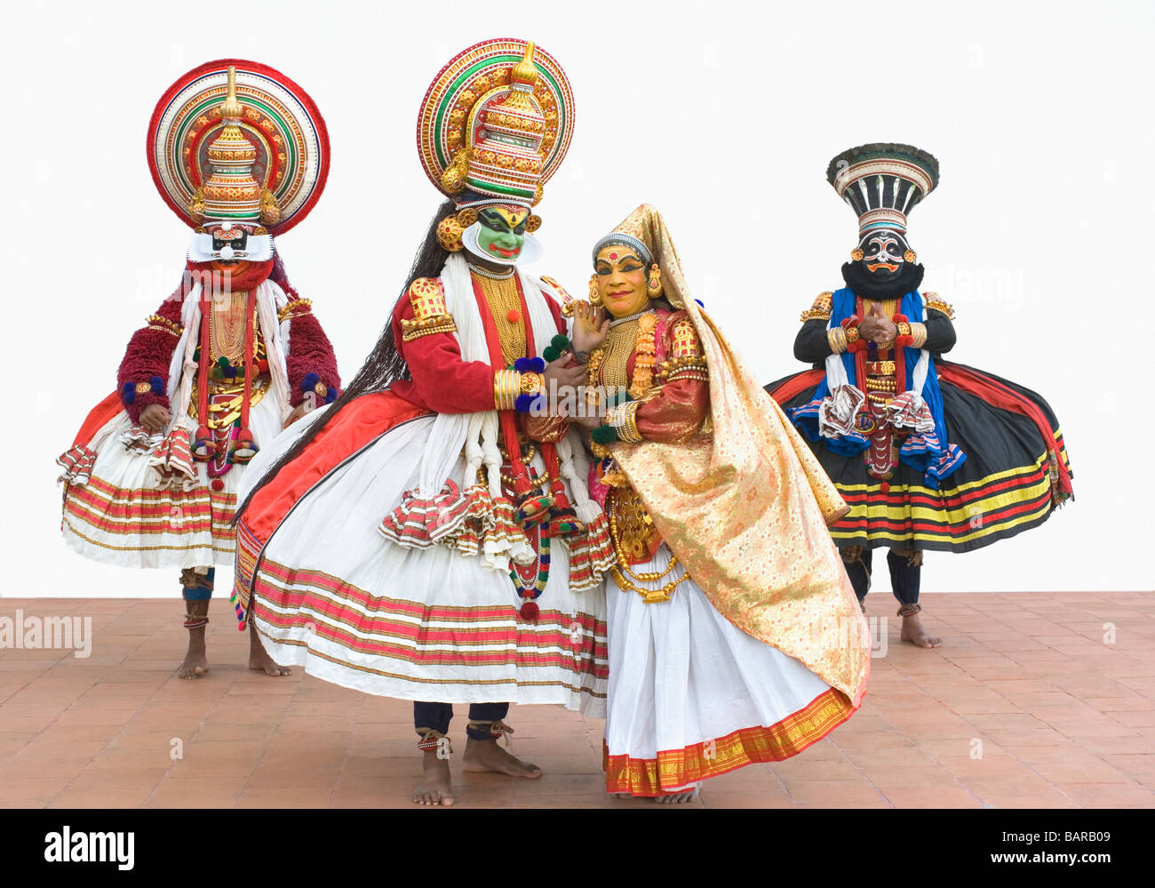 Four people kathakali dancing Stock Photo - Alamy