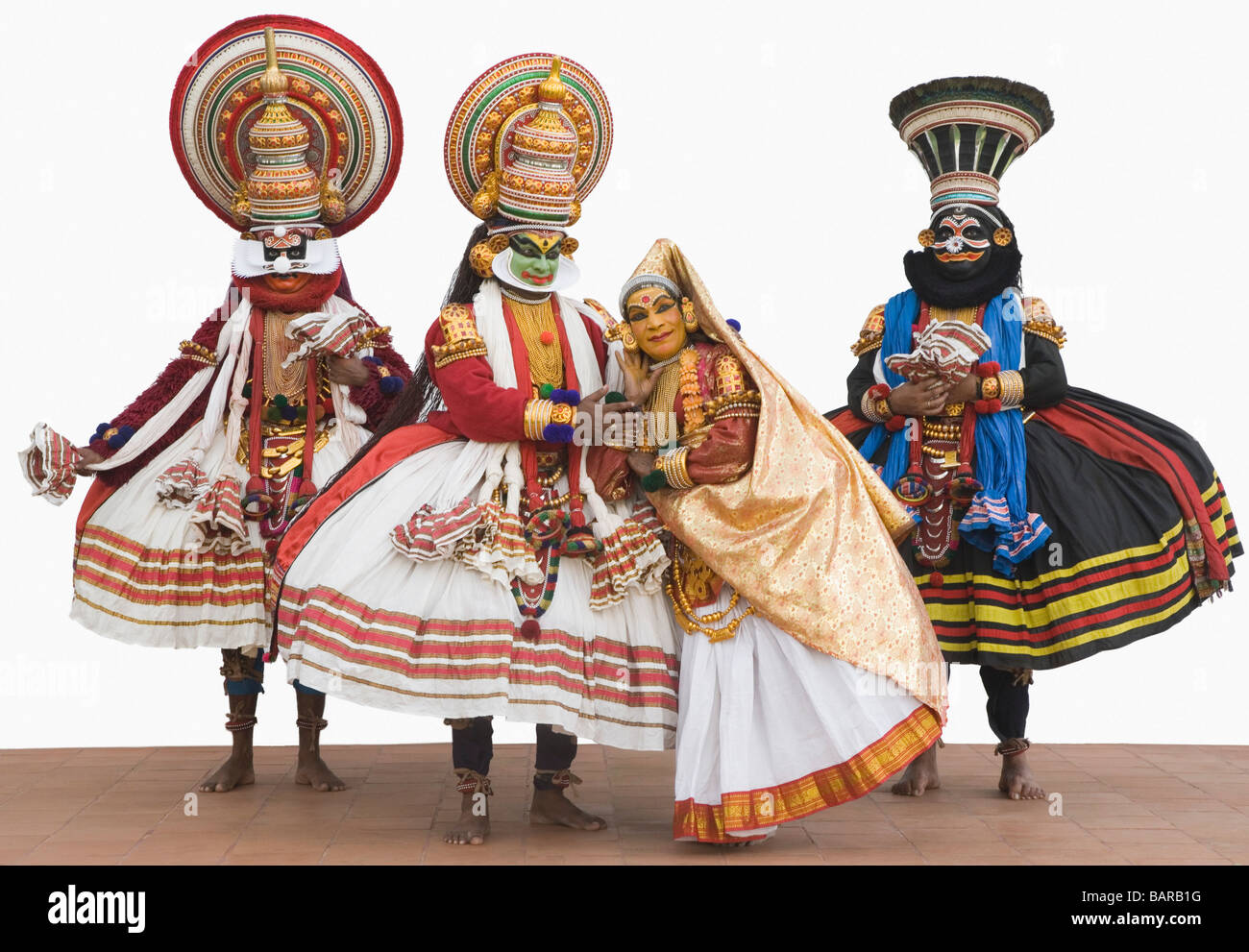 Four people kathakali dancing Stock Photo - Alamy