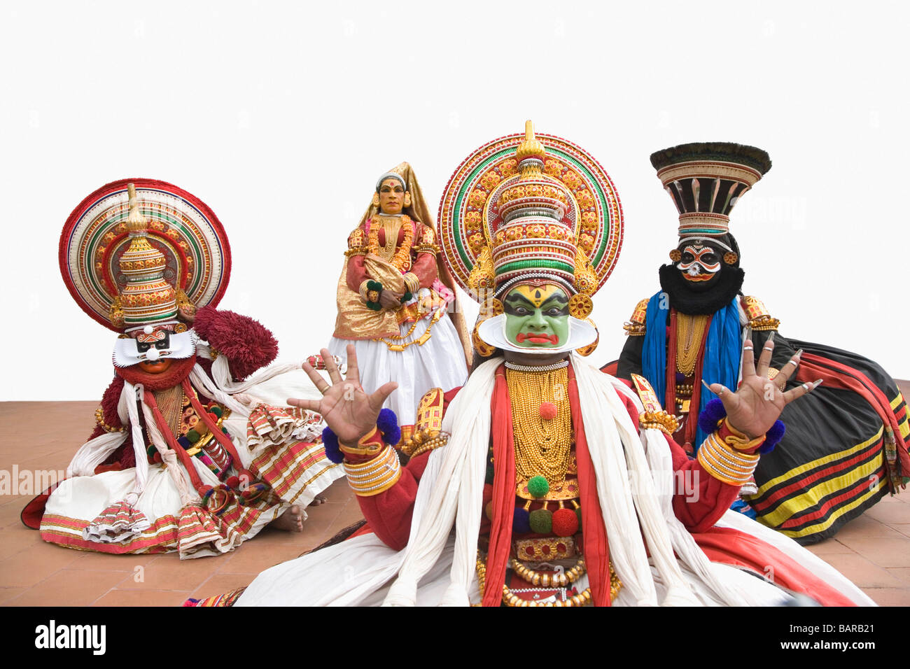 Four people kathakali dancing Stock Photo - Alamy