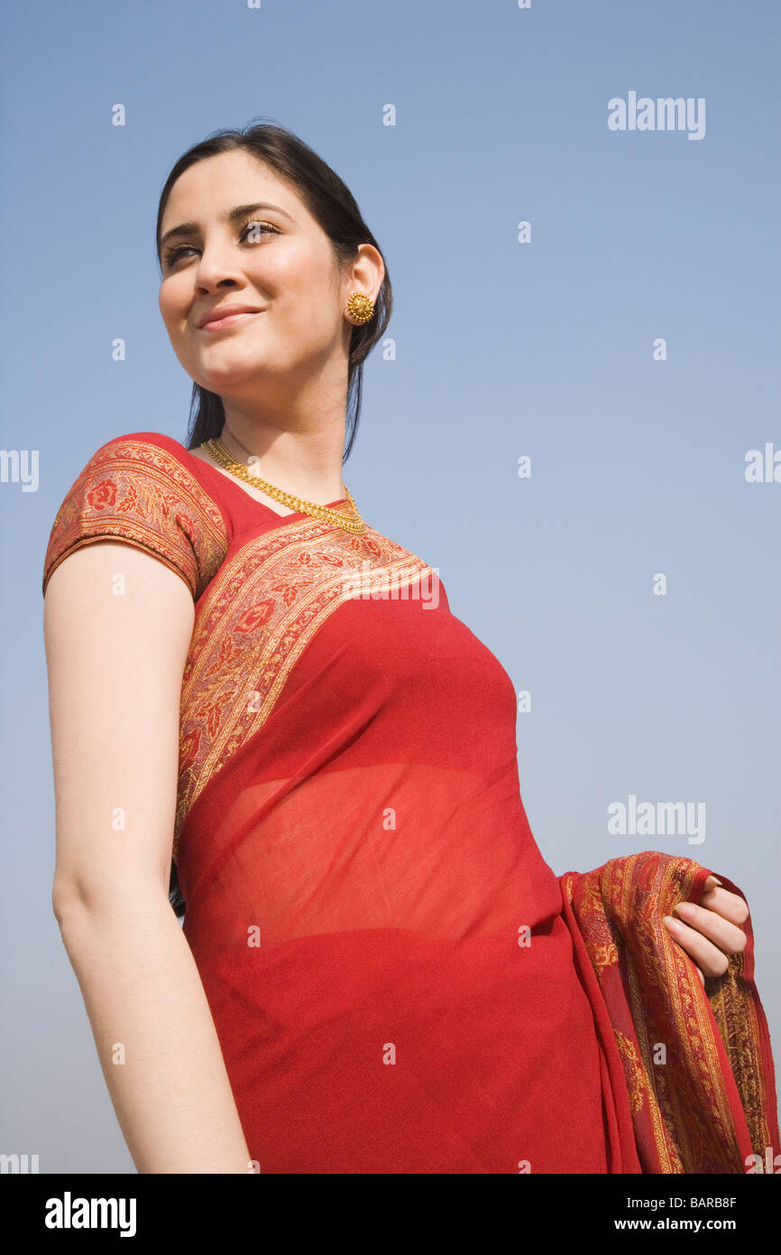 One with a red sari hi-res stock photography and images - Alamy