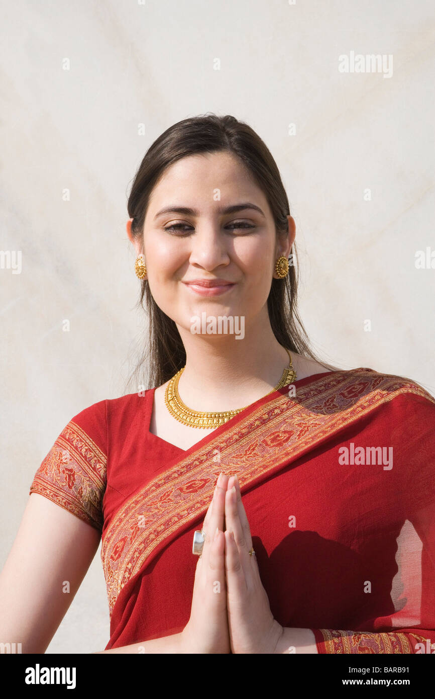 Portrait of a woman greeting with smile Stock Photo - Alamy