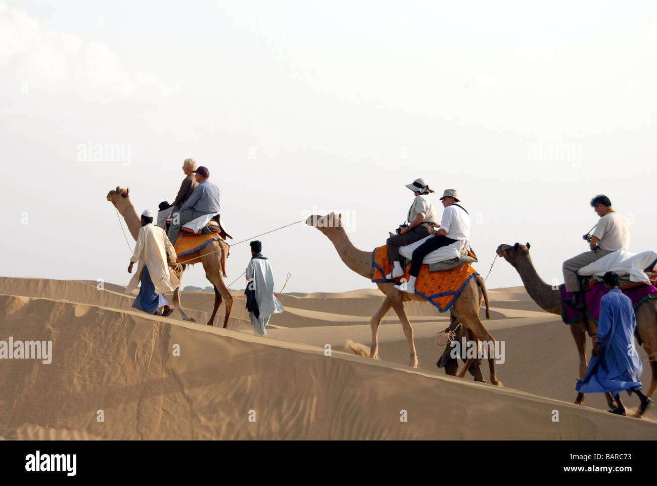 Tourist camel ride in the Thar Desert Jaisalmer Rajasthan India Stock ...