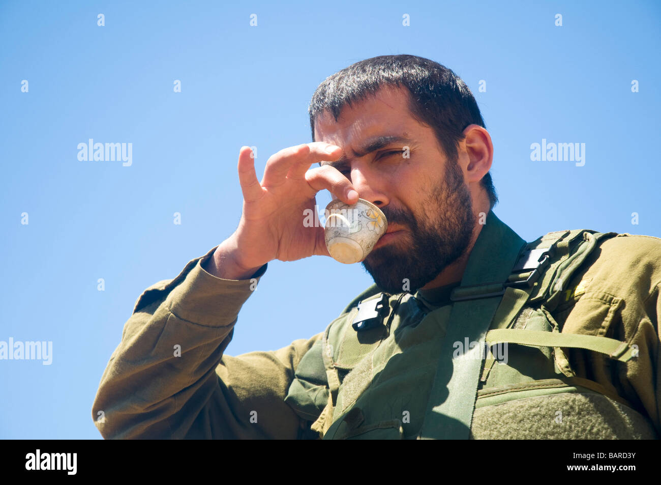 Israel West Bank Israeli reserve soldier drinking freshly brewed coffee ...