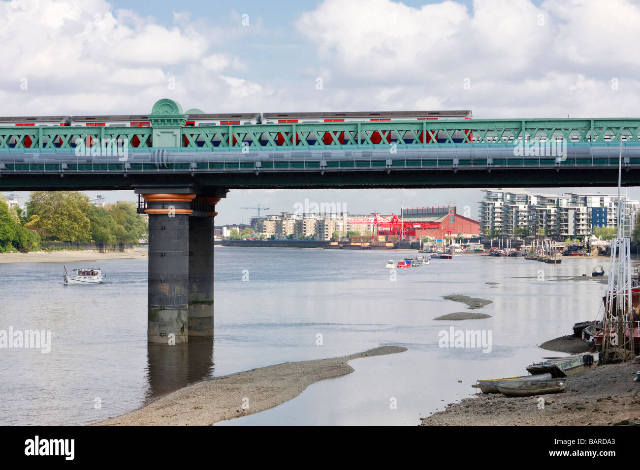 Putney Railway Bridge and district line tube train and view of River ...
