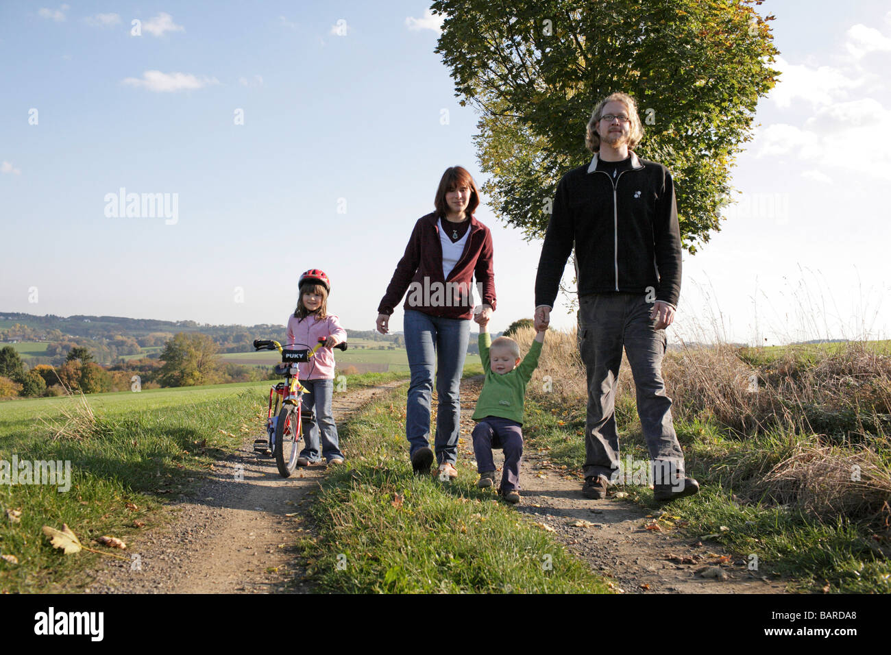 family taking a walk Stock Photo - Alamy