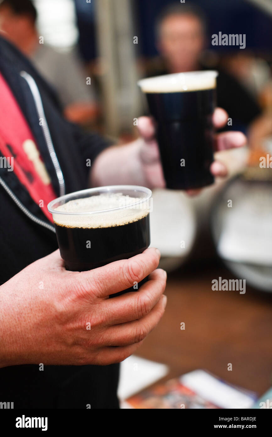 Man holding pints hi-res stock photography and images - Alamy