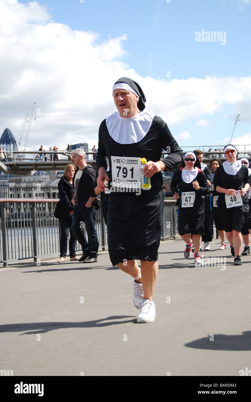 Nun Fun Run Habit London Barnardo's charity Stock Photo - Alamy