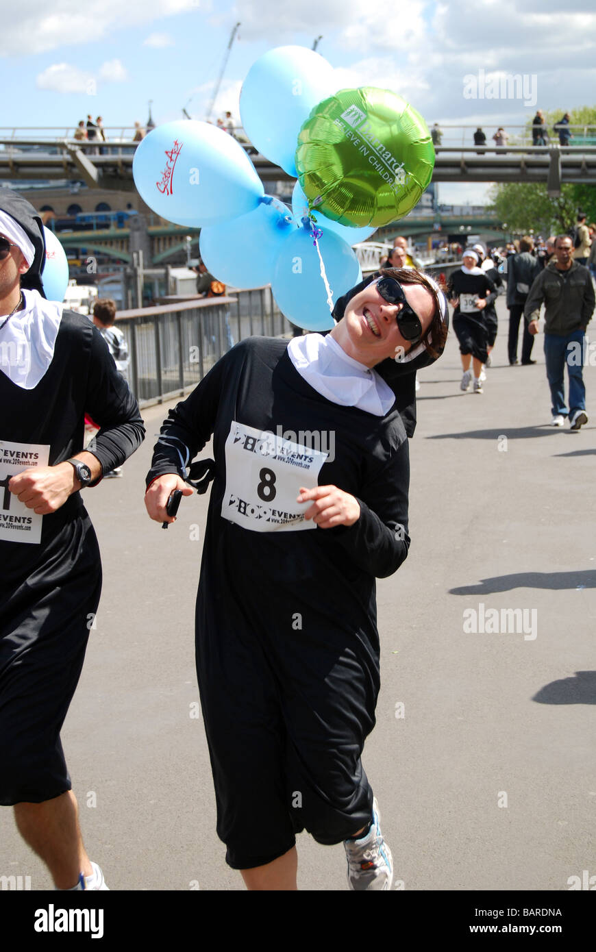 Nun Fun Run Habit London Barnardo's charity Stock Photo - Alamy