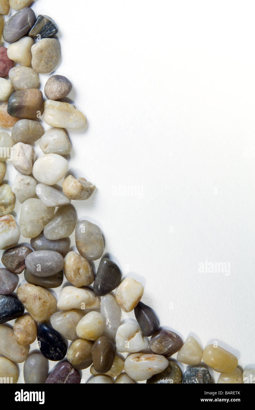 Scattered pebbles forming borders on left and base. Isolated. Copy ...