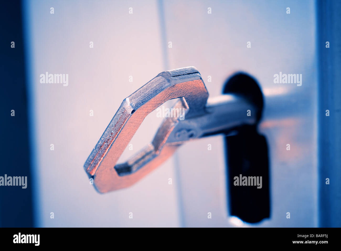 Key in the keyhole Stock Photo - Alamy