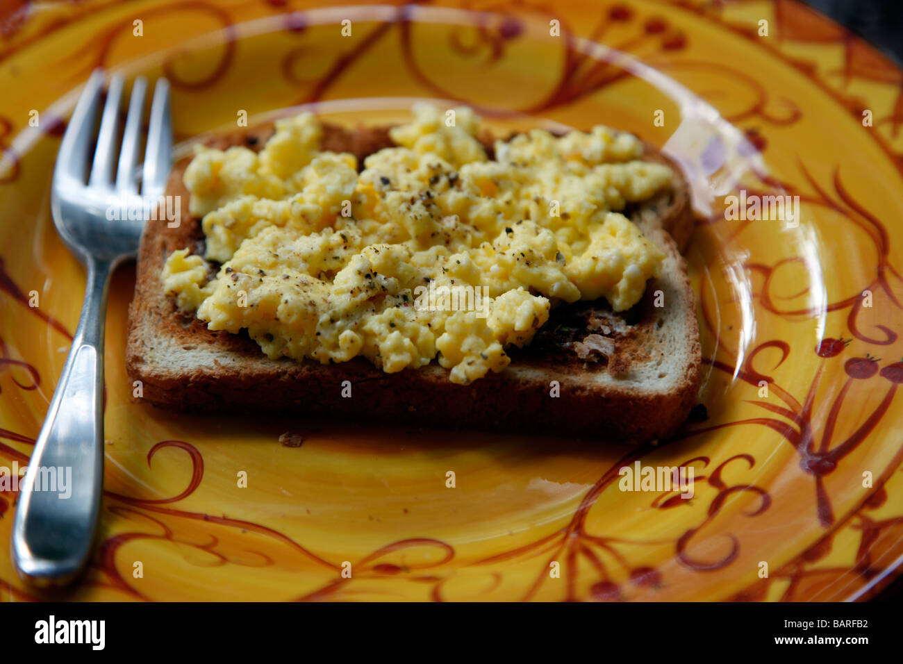 Scrambled eggs on toast Stock Photo - Alamy
